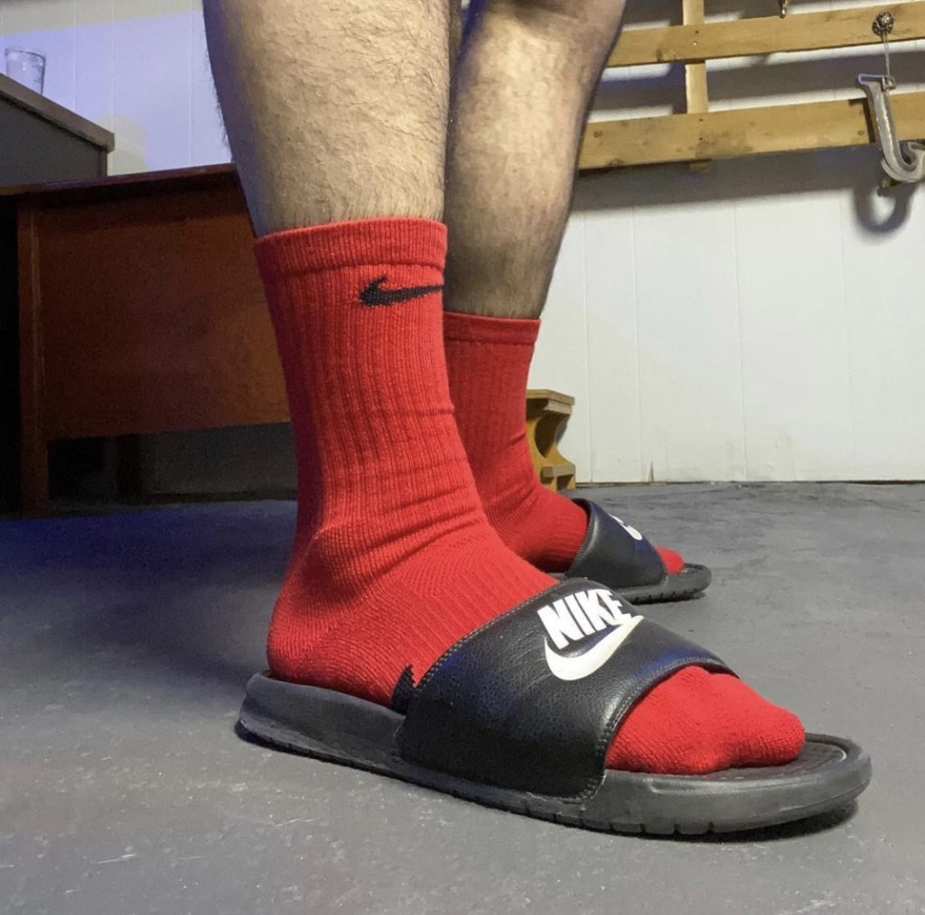 Thatdudeinsneaks in red Nike crew socks and Nike slides - Male Feet Blog