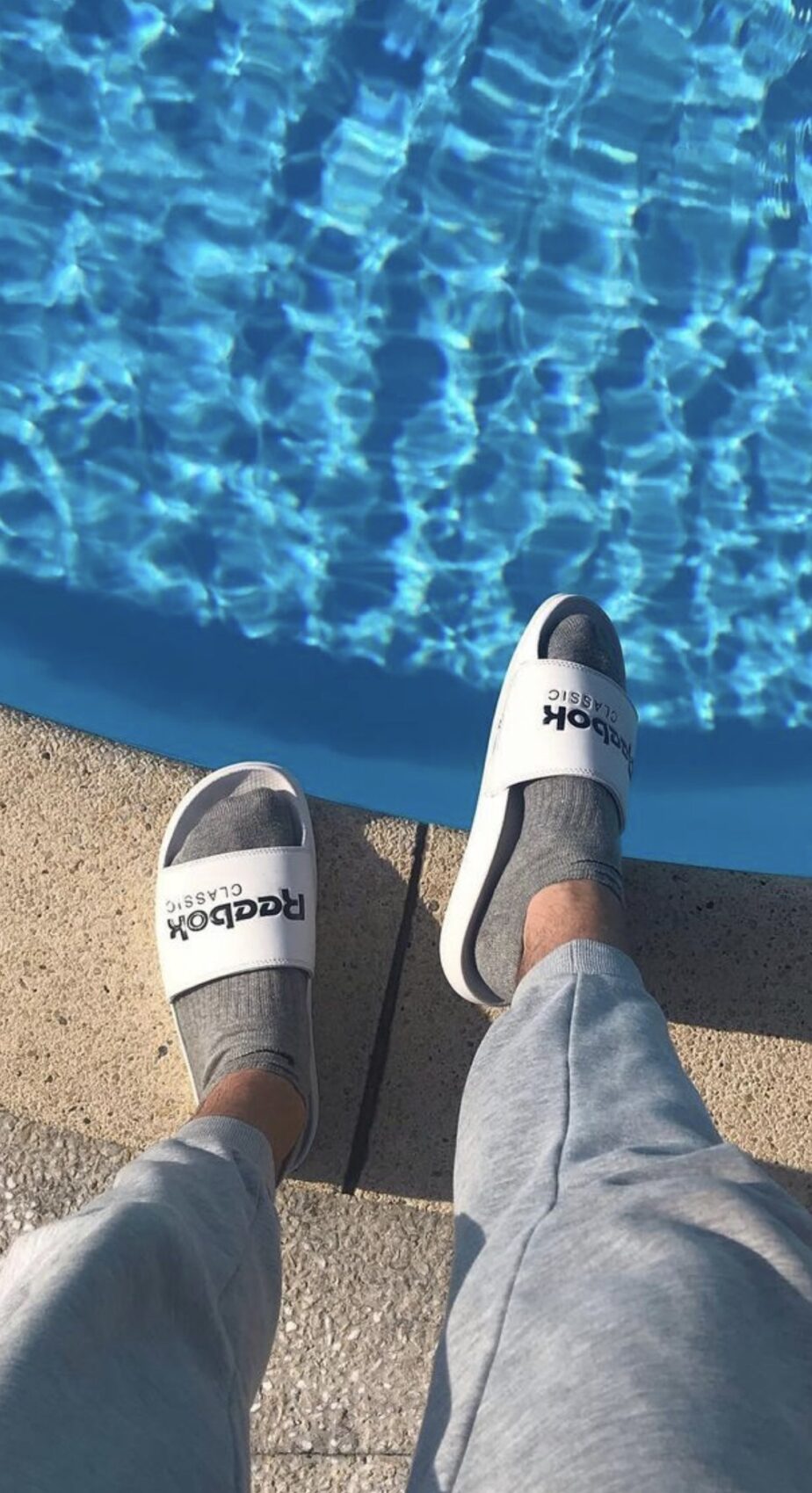 swisssocks in gray ankle socks and Reebok slides by the pool - Male ...